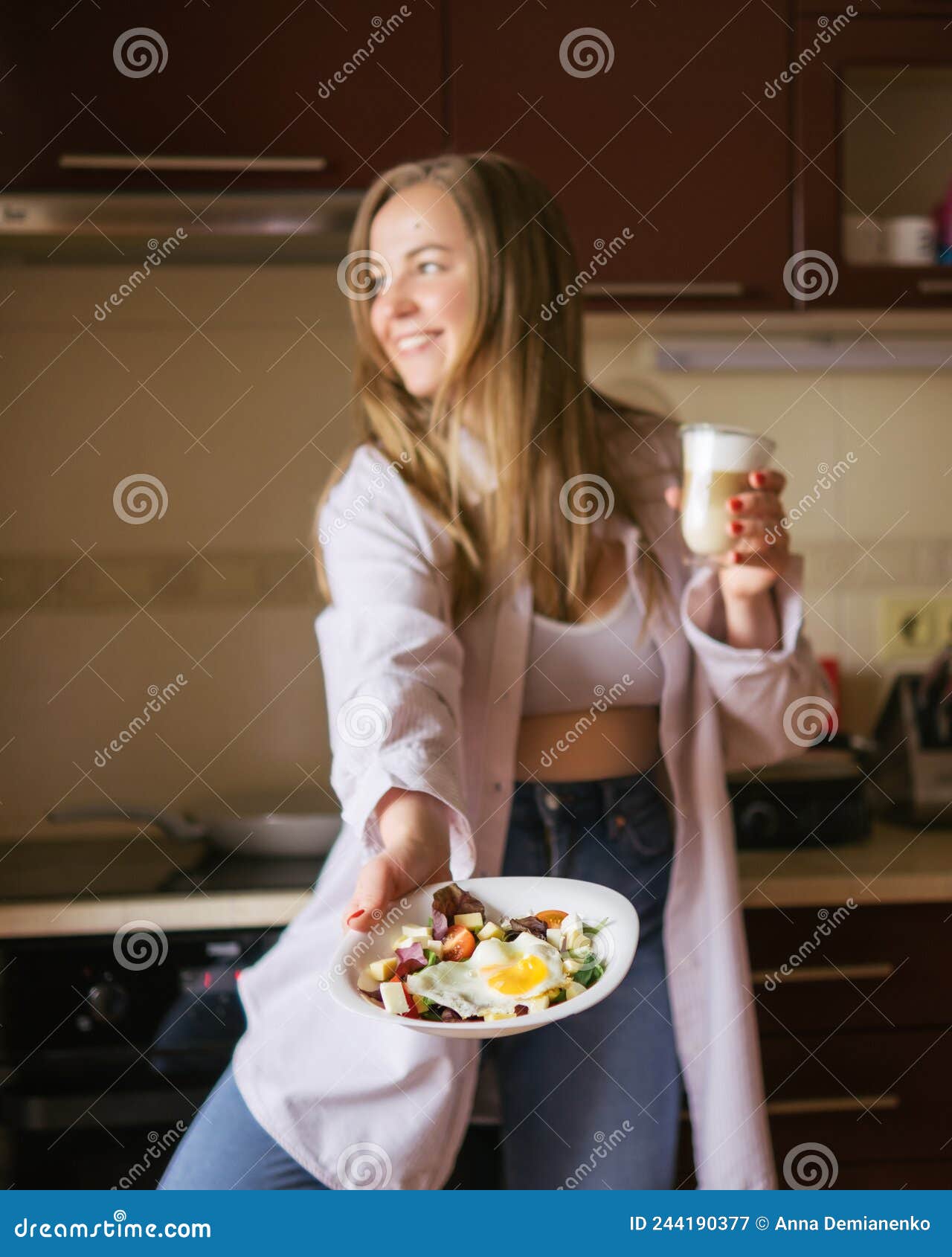 Woman Cooking Breakfast on Her Kitchen at Home. Focus on Tthe Eggs on ...