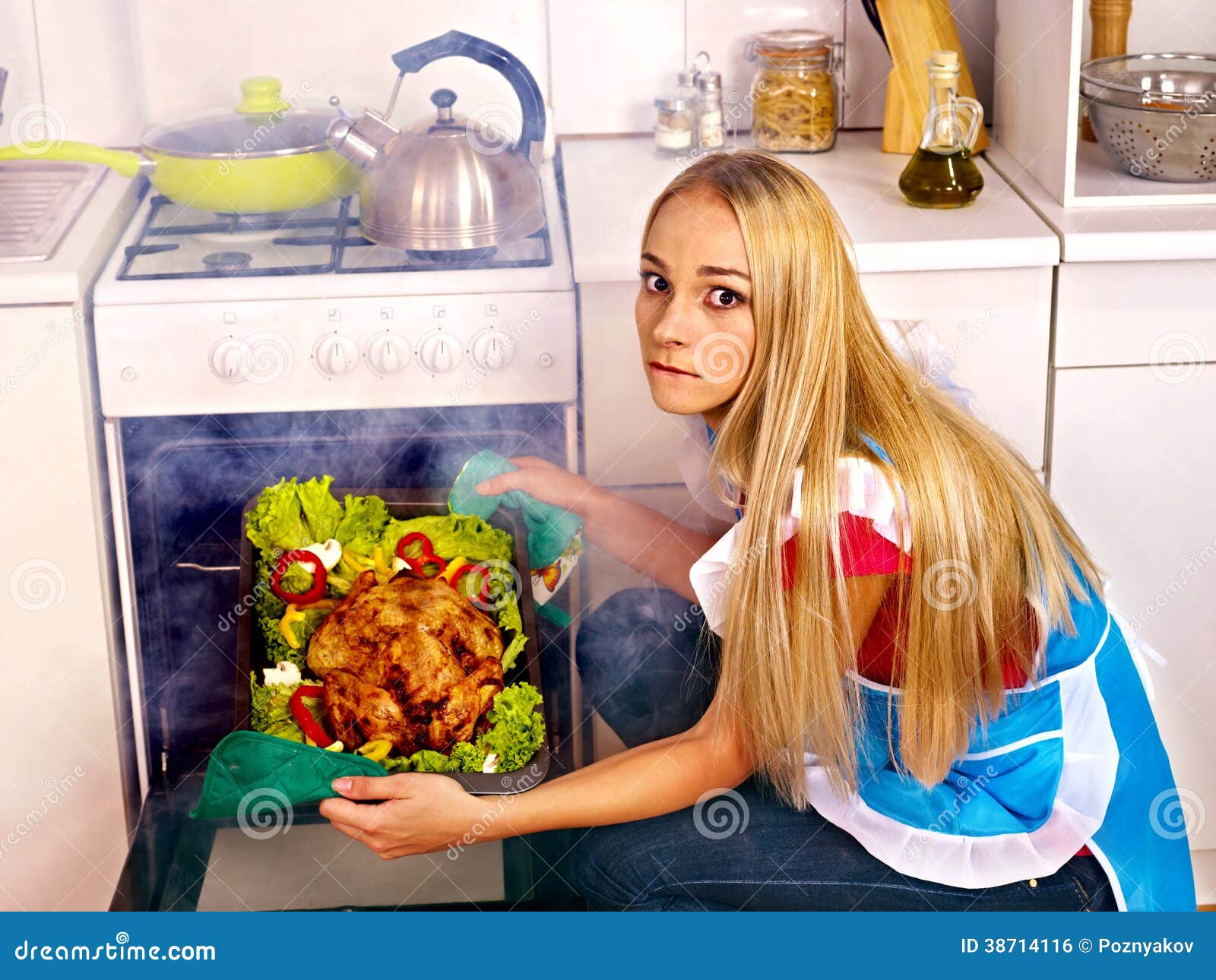 Woman Cooking Chicken at Kitchen. Stock Photo - Image of kitchen, food ...
