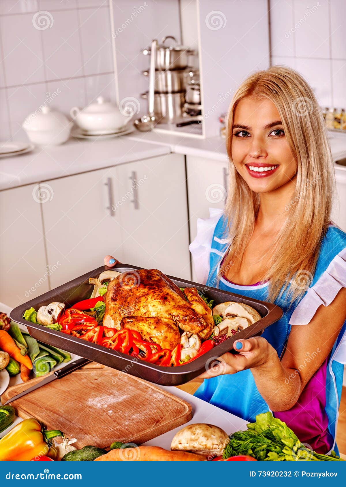 Woman Cooking Chicken at Kitchen. Stock Photo - Image of prepare, home ...
