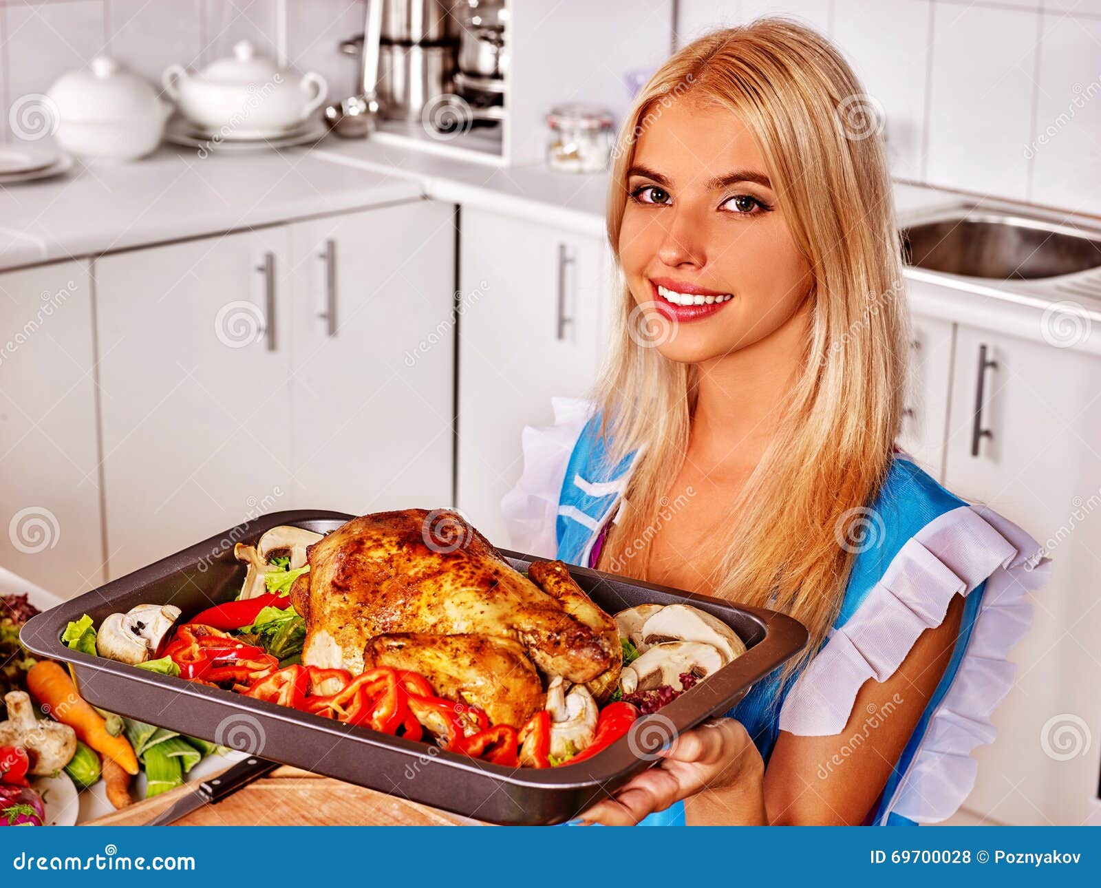Woman Cooking Chicken with Vegetables at Kitchen. Stock Photo - Image ...
