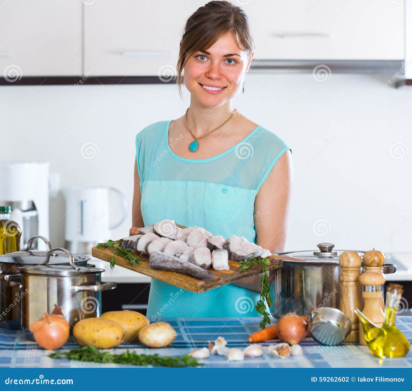 Woman Cooking Fish in Kitchen Stock Photo - Image of indoor, dish: 59262602