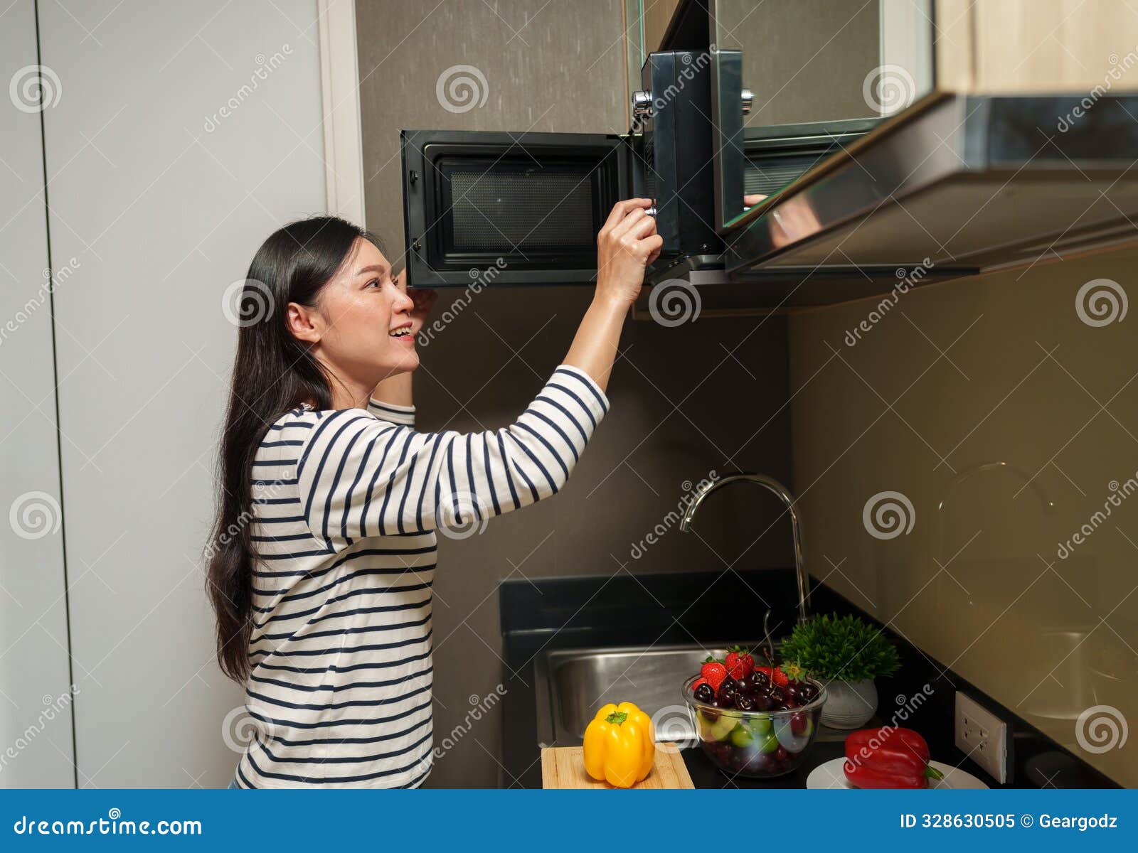 Woman Cooking with a Microwave in Kitchen Room Stock Image - Image of ...