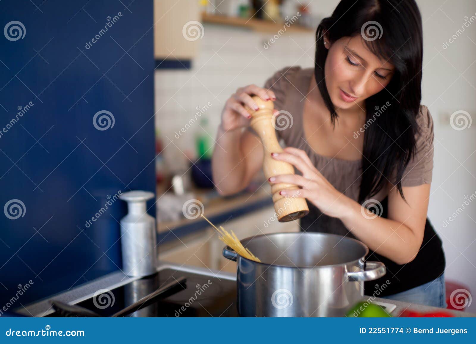 Woman Cooking Pasta stock photo. Image of boiling, cook - 22551774