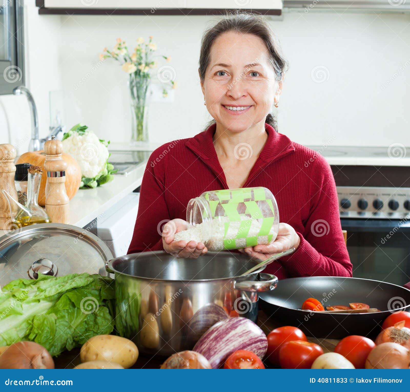 Woman cooking with rice stock image. Image of vegetables - 40811833