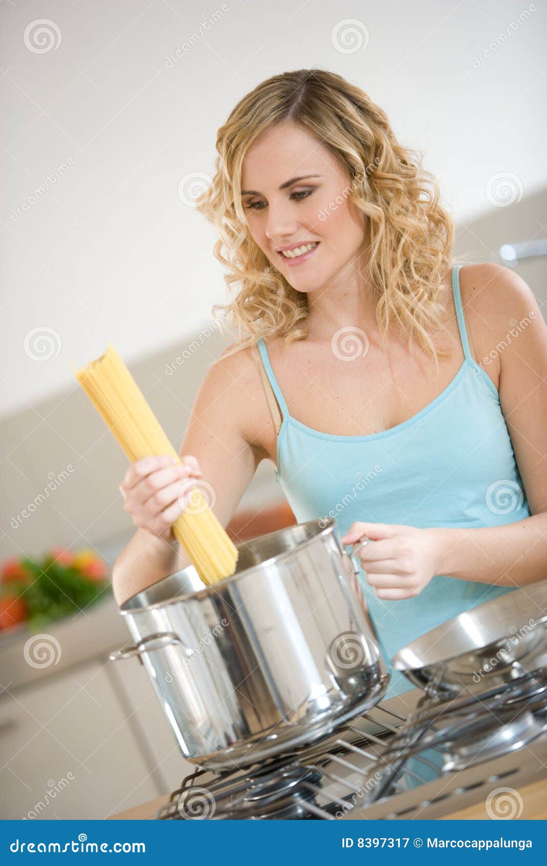 Woman cooking spaghetti stock image. Image of beautiful - 8397317