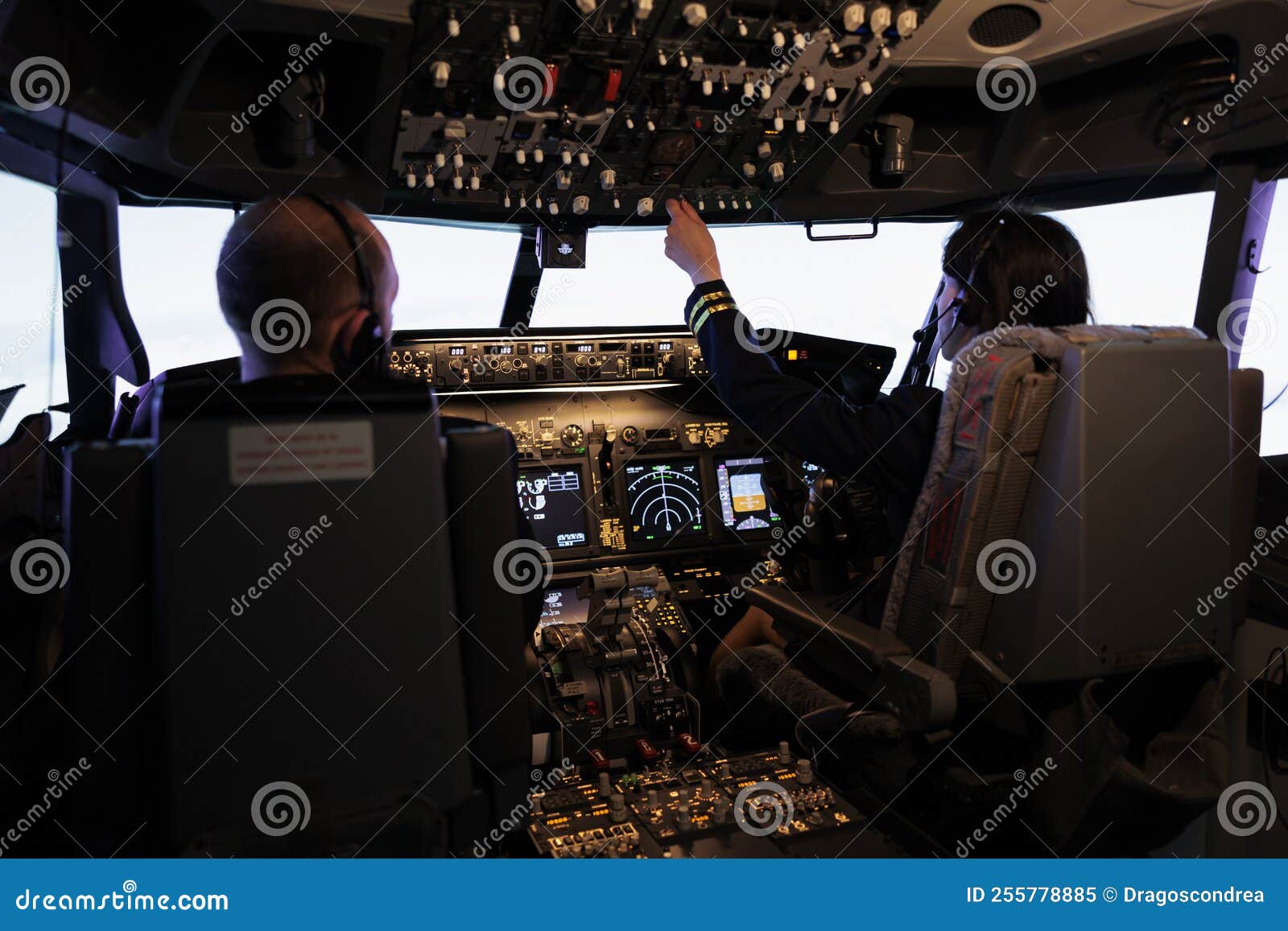 Woman Copilot Assisting Captain To Takeoff and Fly Airplane Stock Image ...
