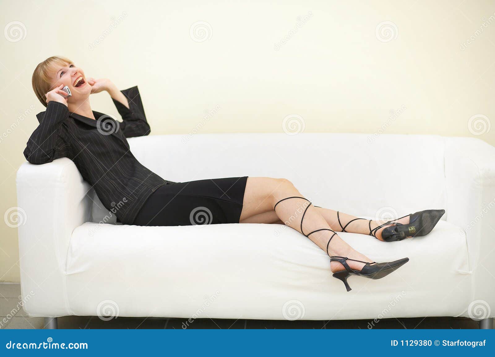 Woman on a Couch Comfortable Talking with Cell Phone Stock Photo ...