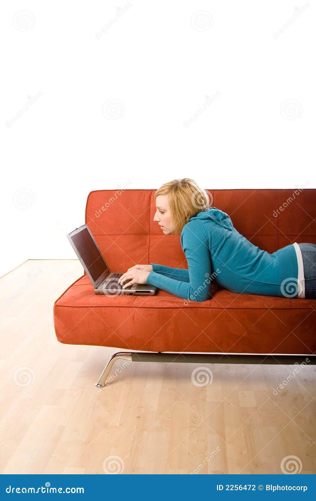 Woman on couch with laptop stock photo. Image of learning - 2256472