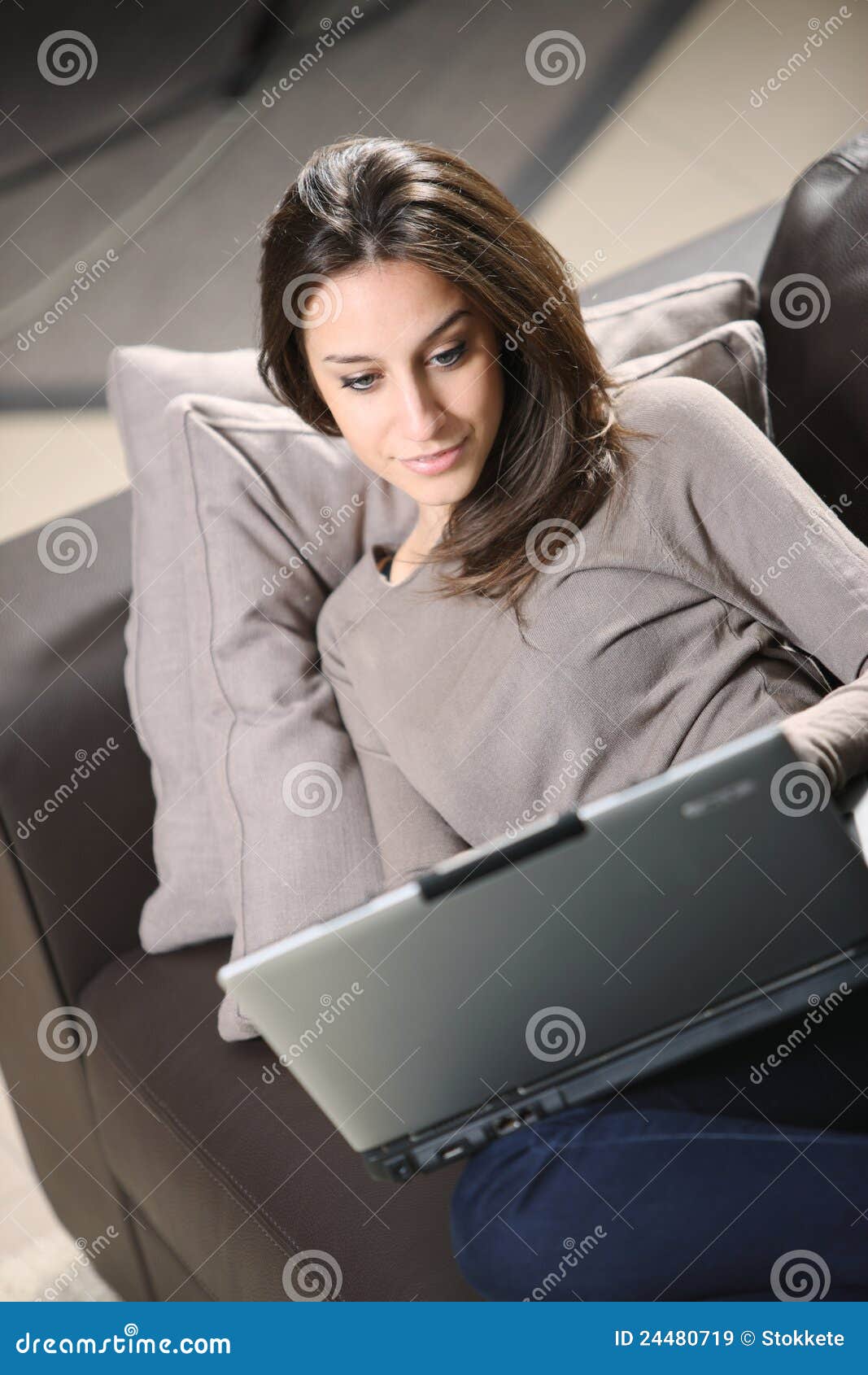 Woman on Couch with Laptop stock image. Image of leisure - 24480719