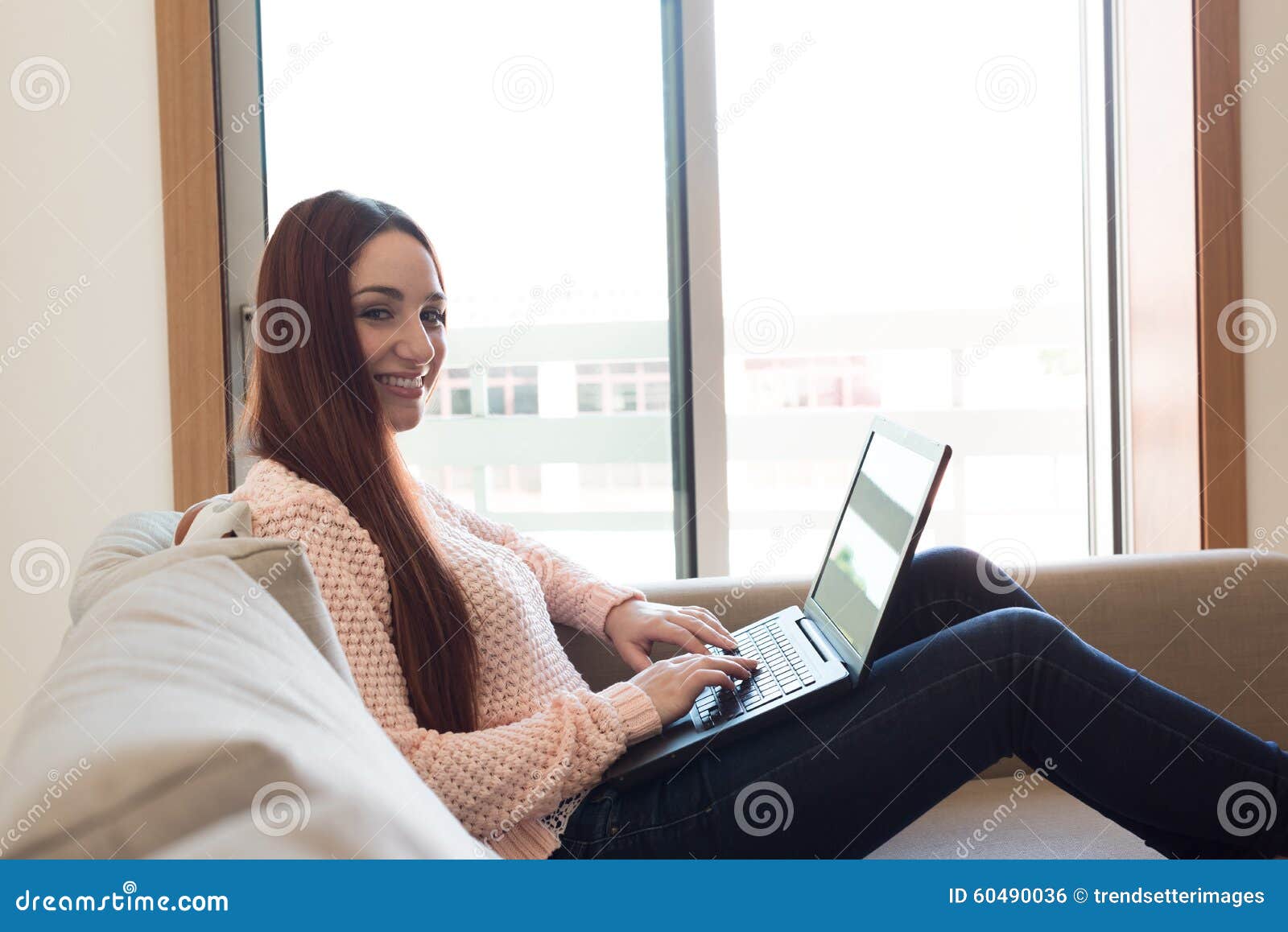 Woman on couch with laptop stock photo. Image of relax - 60490036