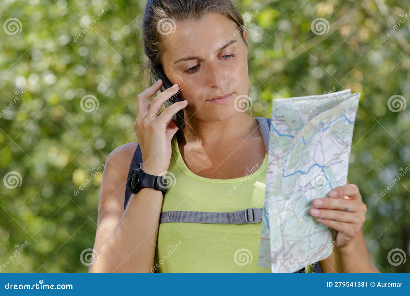 Woman in Countryside Consulting Map and Using Telephone Stock Image ...