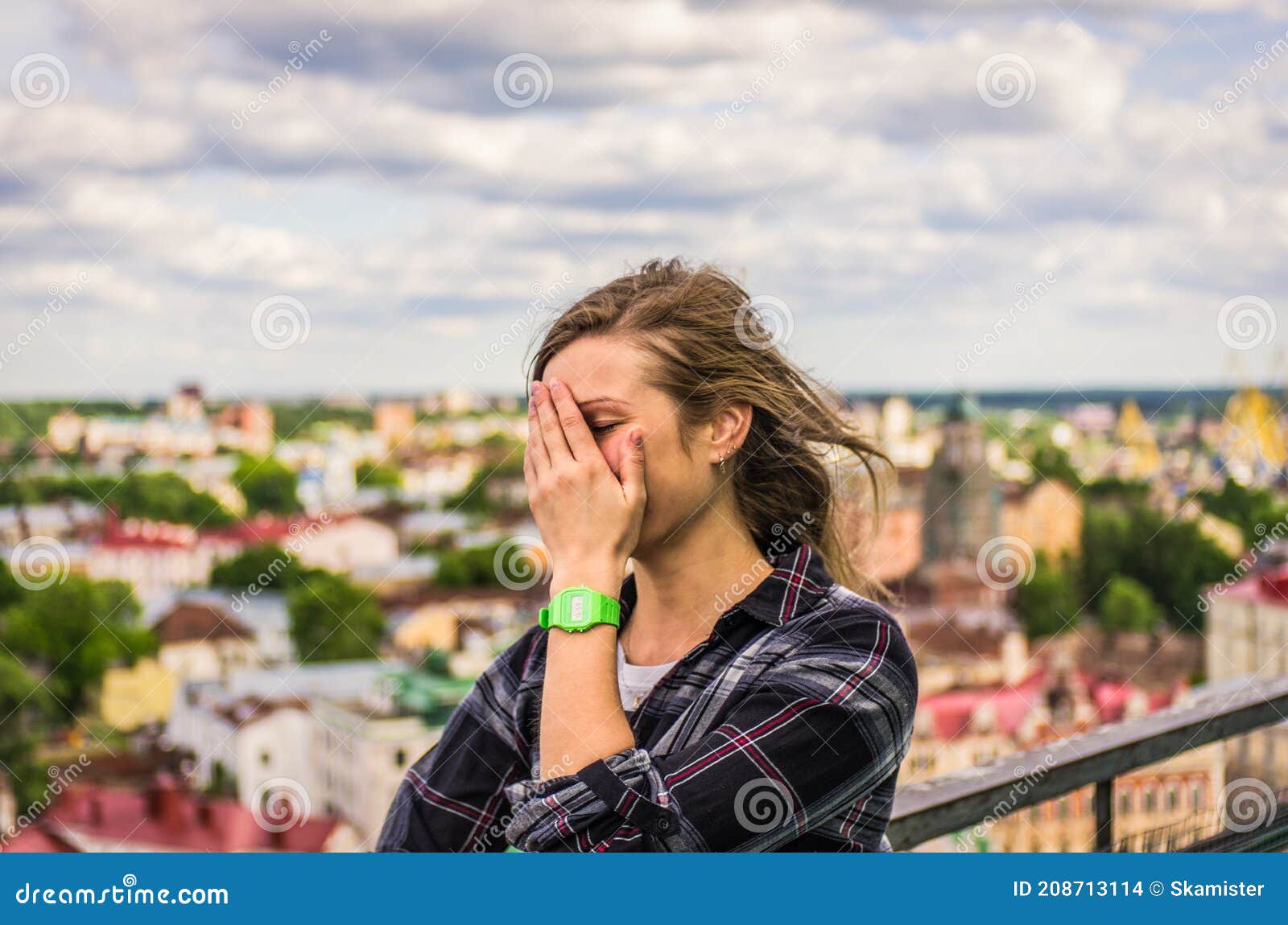 Woman Covers Her Face from the Wind with Her Hand Stock Photo - Image ...