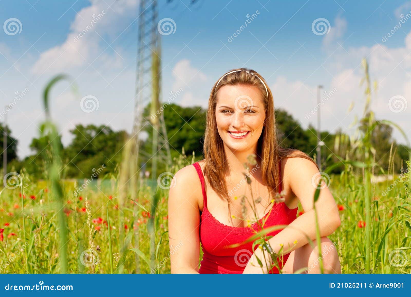 Woman Cowering in Meadow of Field Stock Image - Image of female, meadow ...