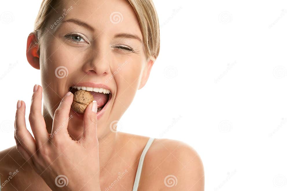 Woman cracking walnut stock photo. Image of beautiful - 14134280