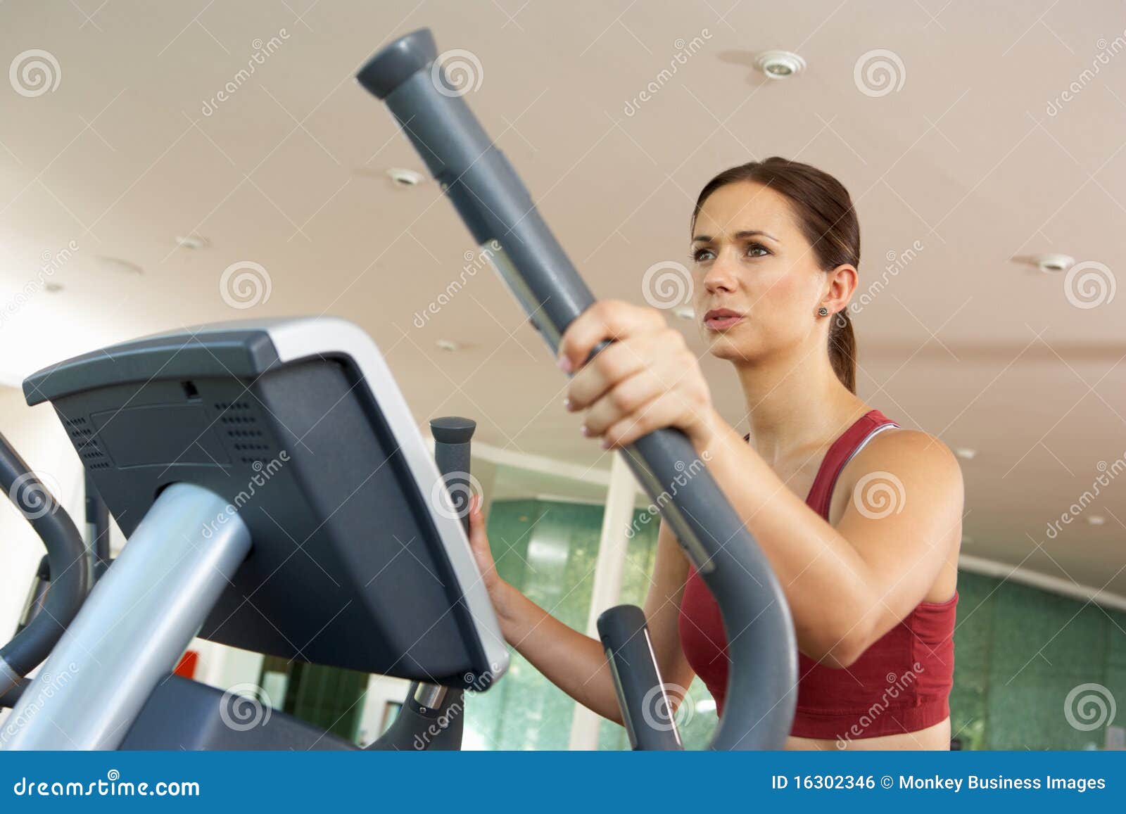 Woman on Cross Trainer Machine Stock Photo - Image of working, keeping ...