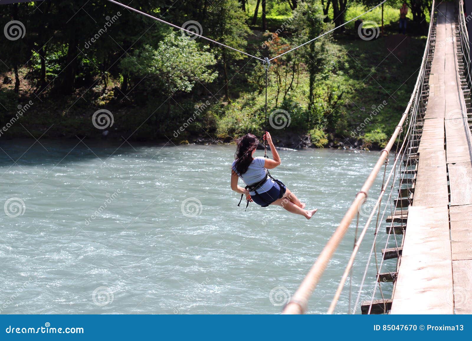 Woman Crossing a River with Tyrolean Traverse Stock Photo - Image of ...