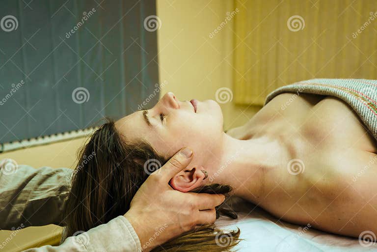 A Woman At A Cst Treatment Session Osteopathic Manipulation And Craniosacral Therapy 3 Stock