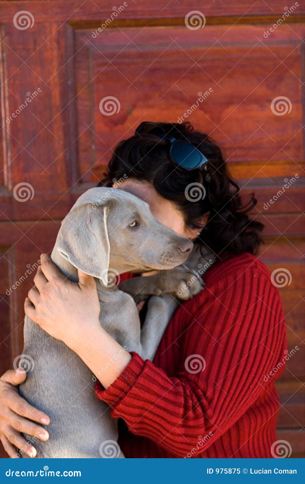 Woman cuddling pet dog stock image. Image of closeup, cuddling - 975875