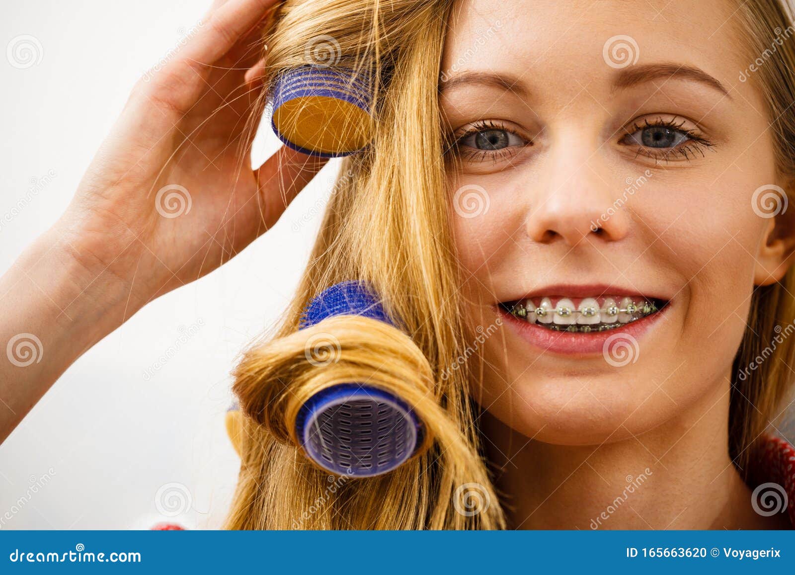 Woman Curling Her Hair Using Rollers Stock Photo - Image of styling ...