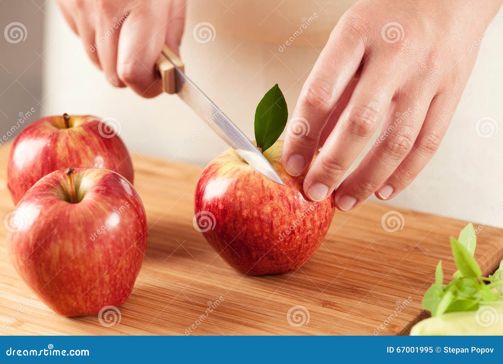 Woman cutting an apple stock image. Image of hold, chopping - 67001995