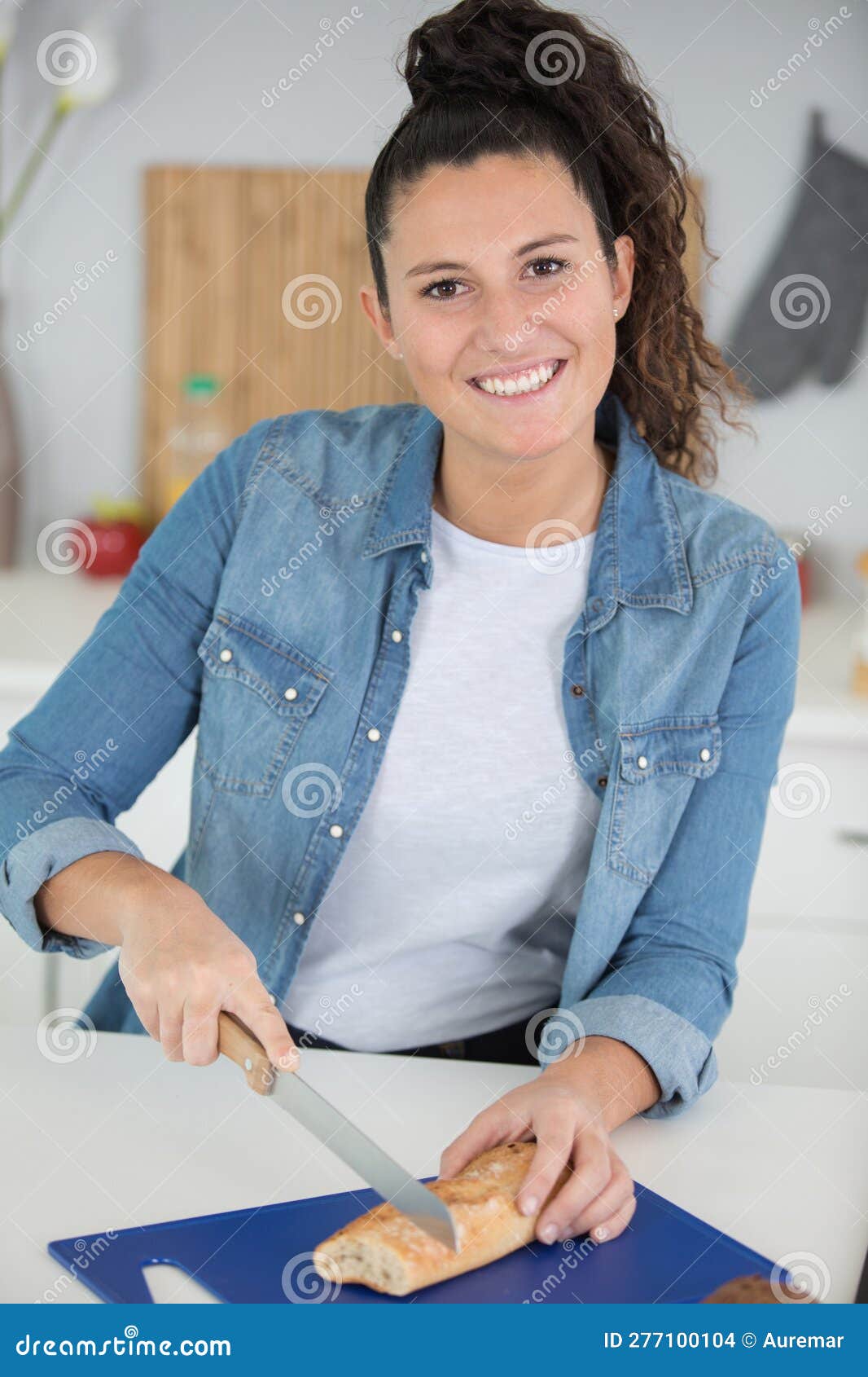 Woman Cutting Bread at Home Stock Photo - Image of modern, woman: 277100104