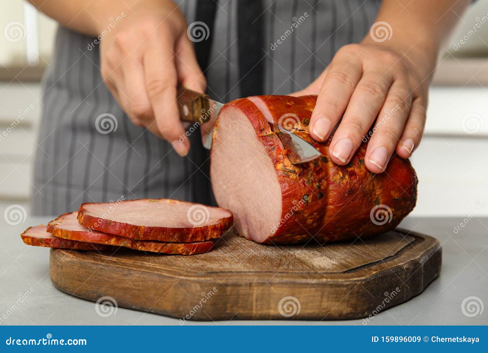Woman Cutting Ham at Table in Kitchen Stock Image - Image of closeup ...