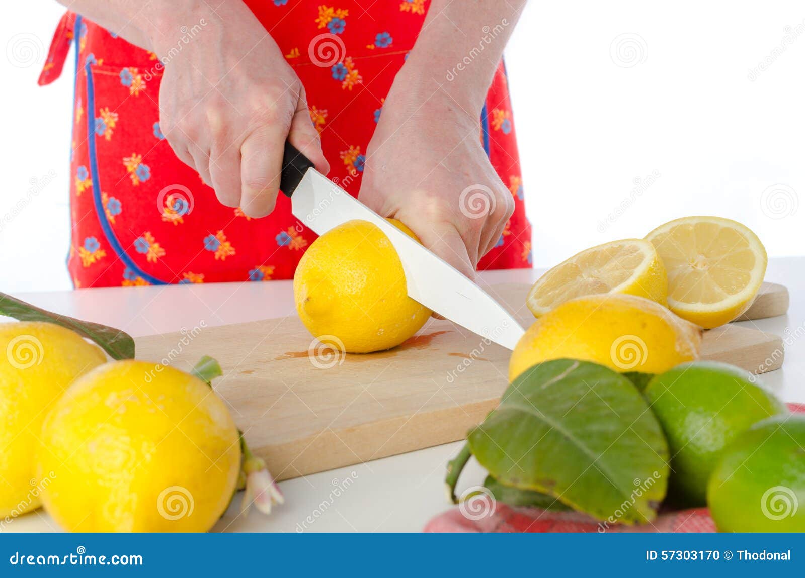 Woman Cutting a Lemon in Half Stock Photo - Image of food, preparation ...