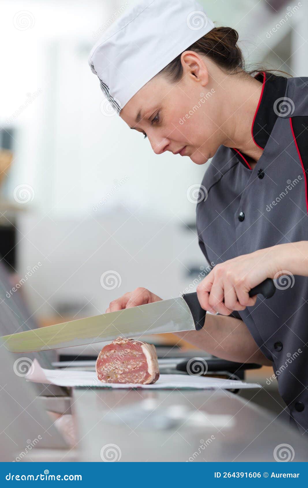 Woman cutting meat stock photo. Image of preparation - 264391606