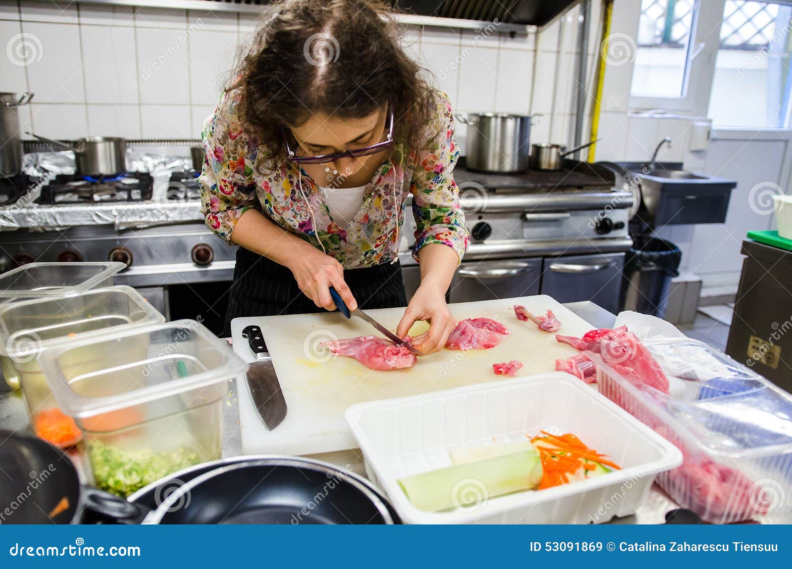 Woman cutting meat stock image. Image of professional - 53091869