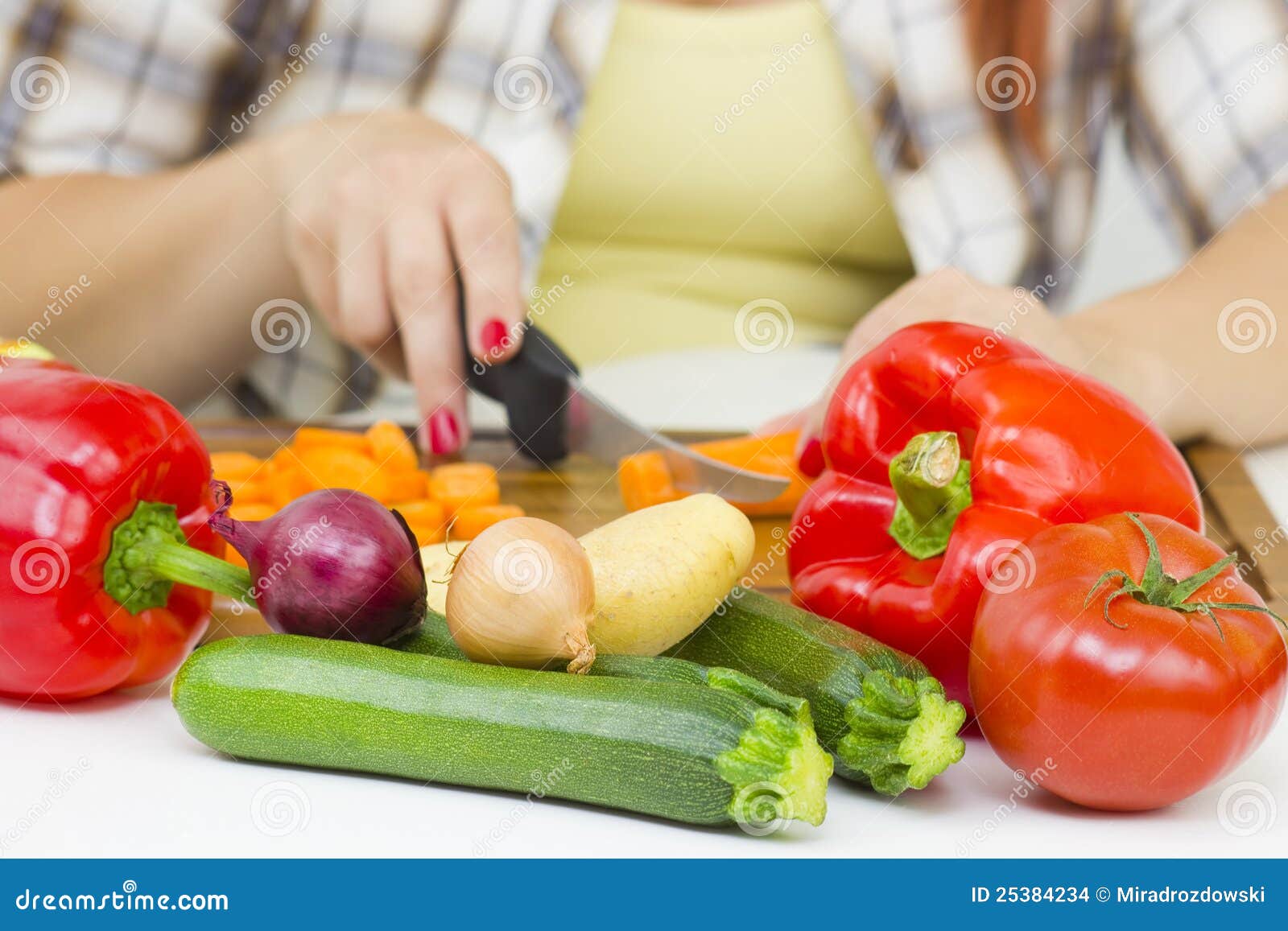 Woman cutting vegetables stock photo. Image of lunch - 25384234