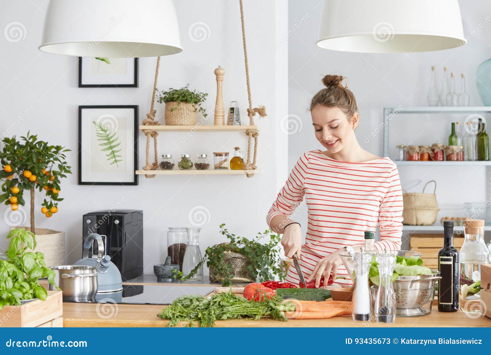 Woman cutting vegetables stock image. Image of modern - 93435673