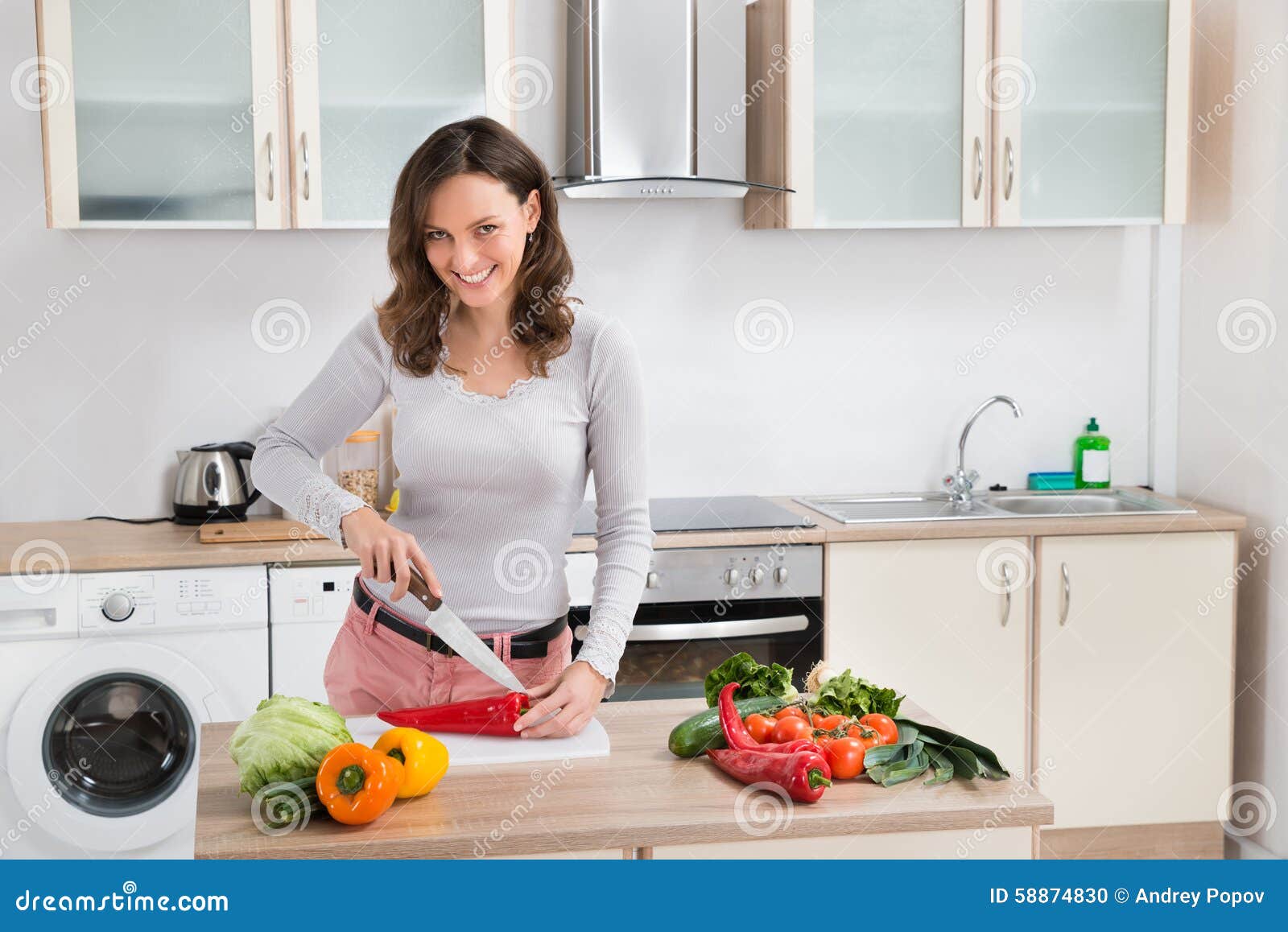Woman Cutting Vegetables stock photo. Image of adult - 58874830