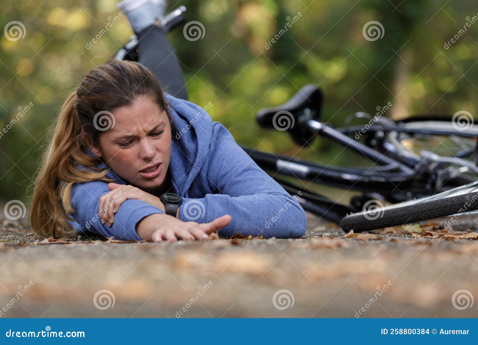 Woman Cyclist with Injuries after Falling Down from Bicycle Stock Photo ...