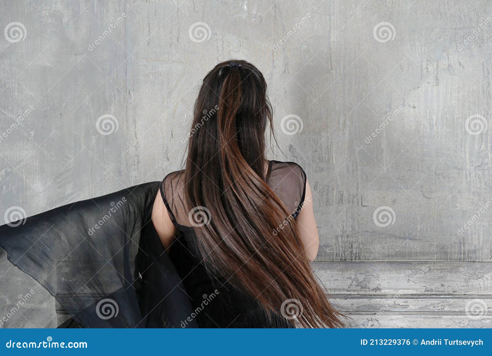 Woman Dancer Backside in Motion with a Cloth Against the Wall Stock ...