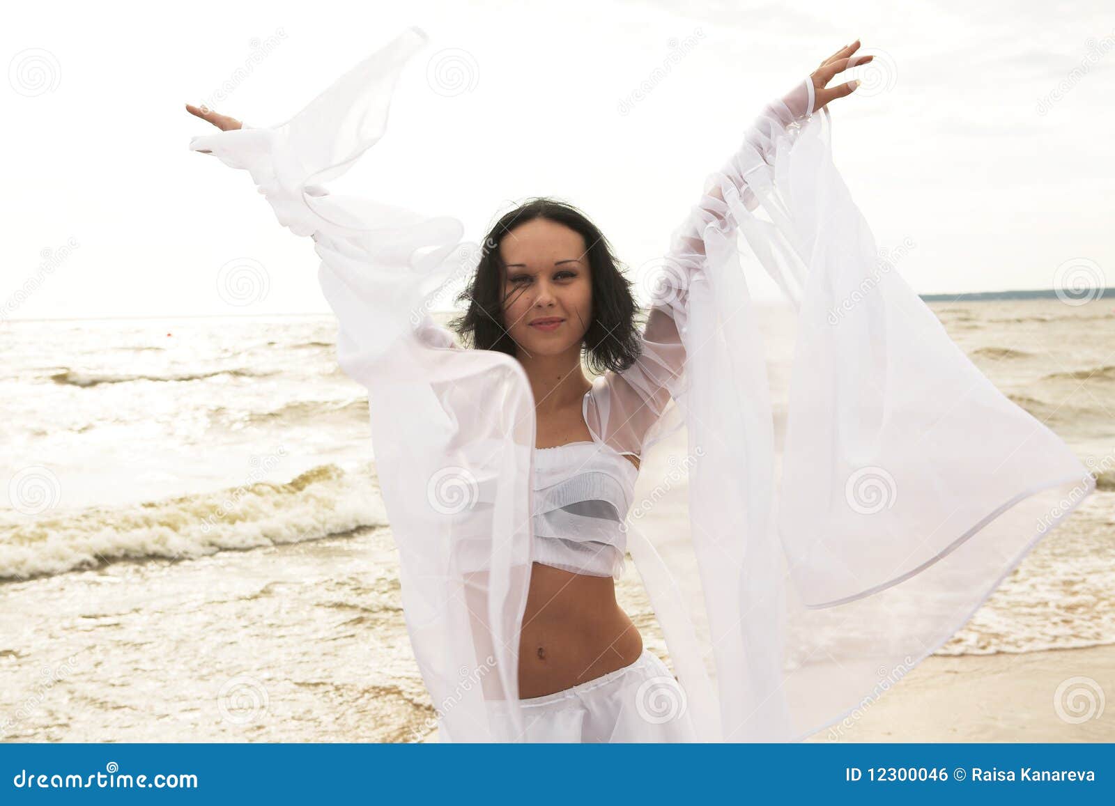 Woman dancing on the beach stock photo. Image of inviting - 12300046