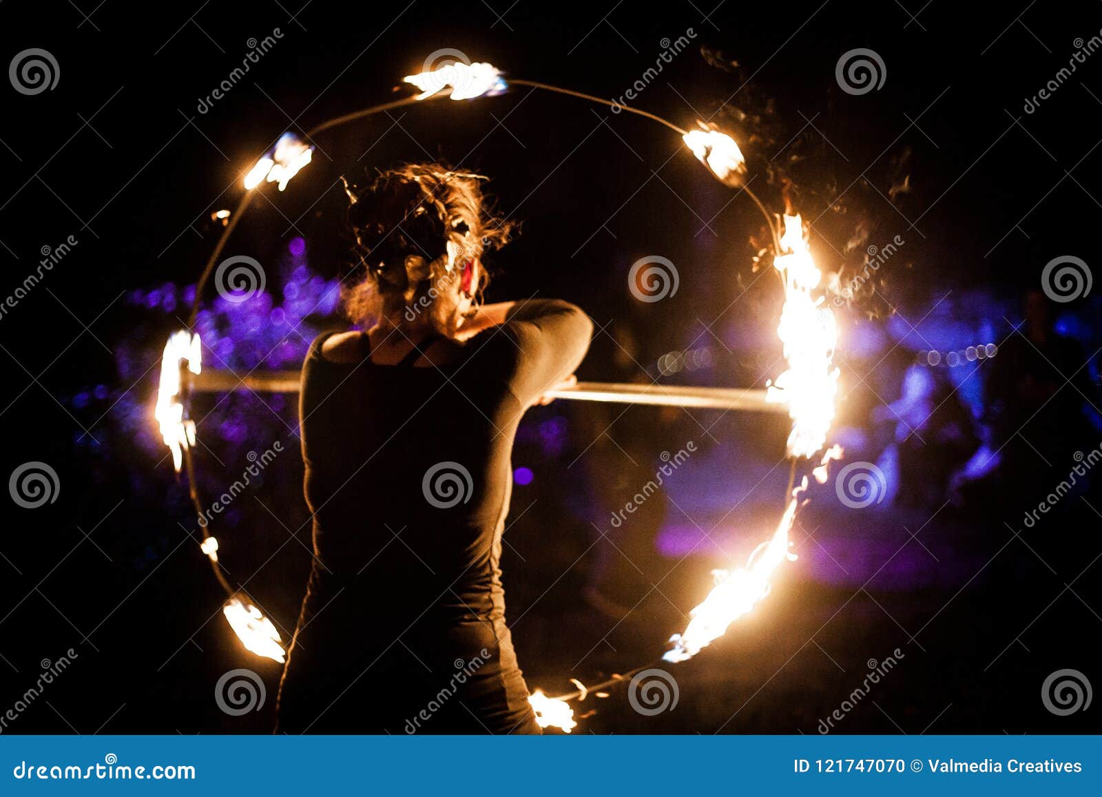 Woman dancing with fire editorial image. Image of night - 121747070