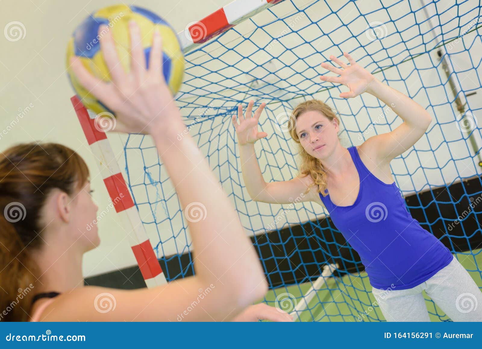 Woman Defending Handball Net from Opponent Stock Image - Image of ...