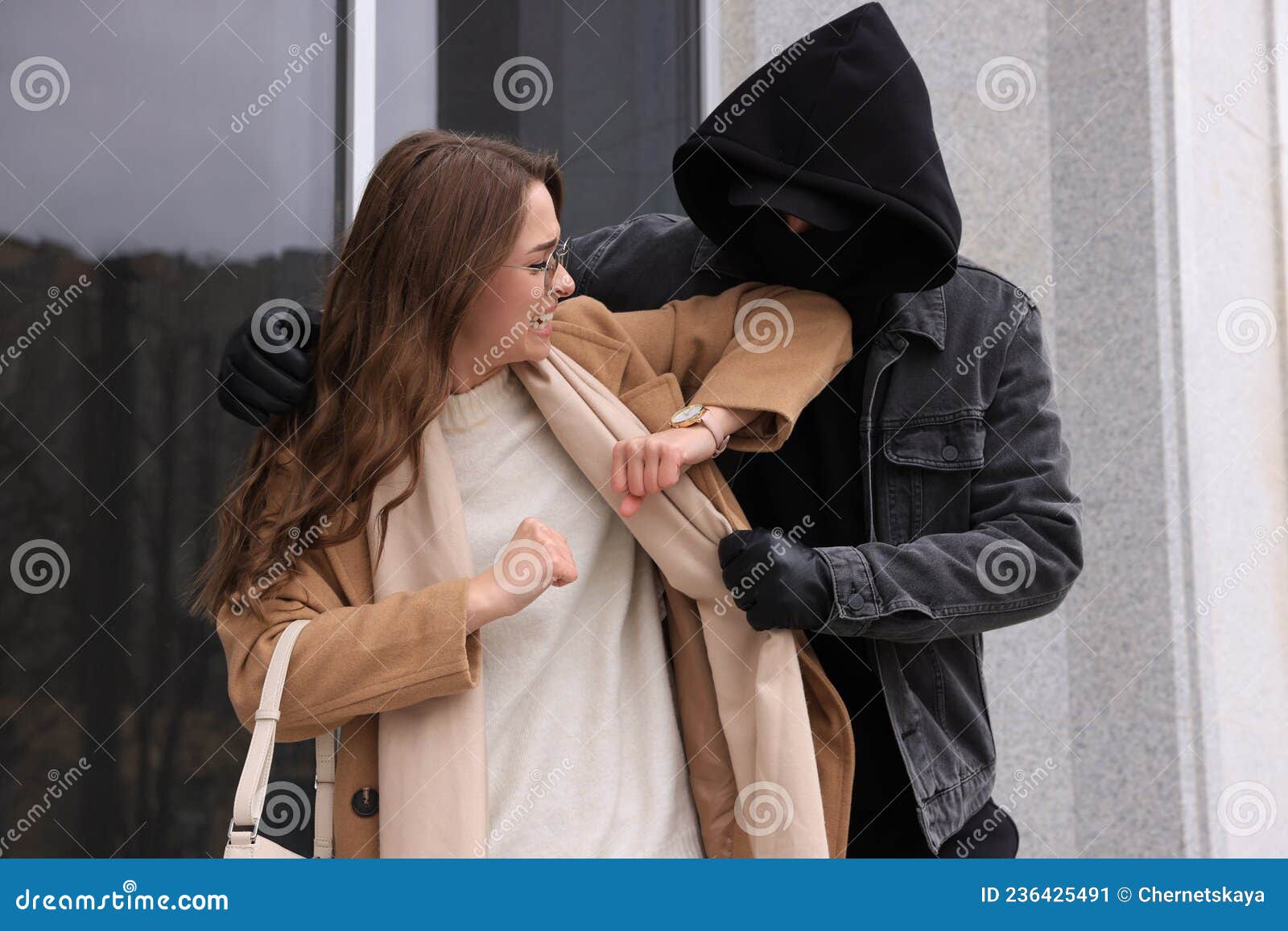 Woman Defending Herself from Attacker Near Building Stock Image - Image ...
