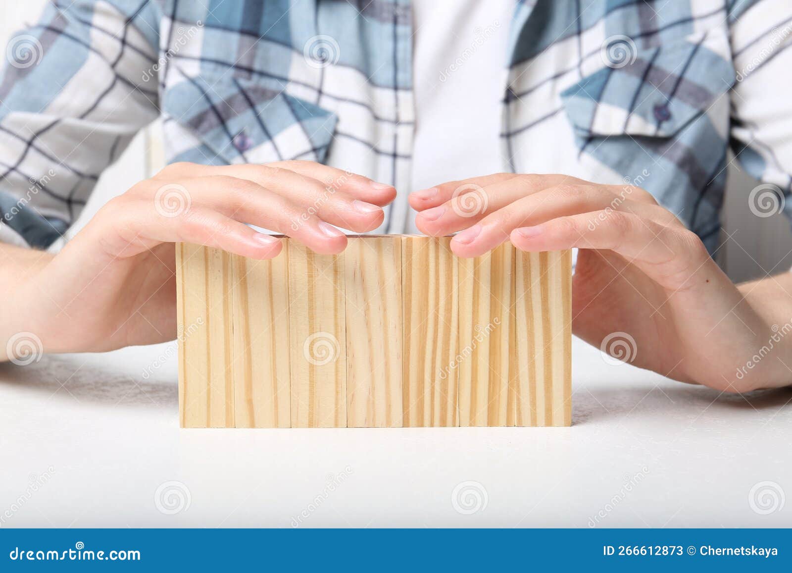 Woman Demonstrating Empty Blocks at White Table, Closeup. Space for ...