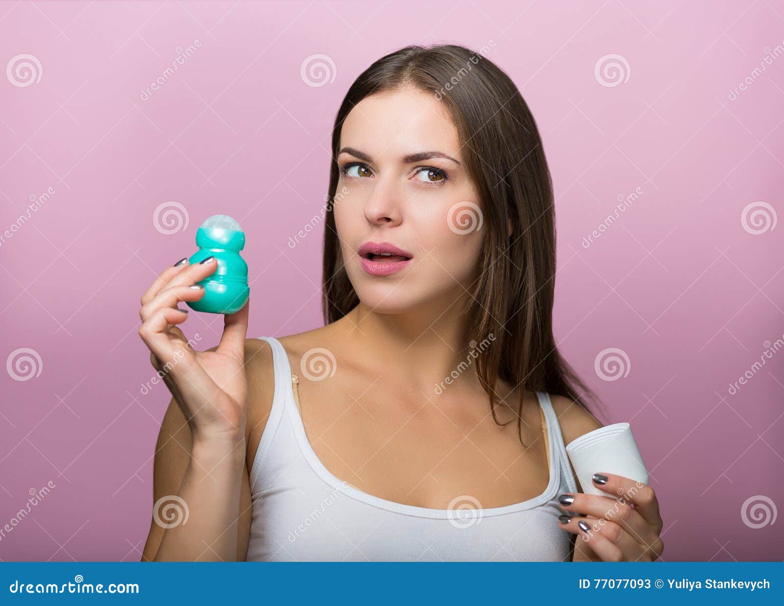Woman with a deodorant stock image. Image of bottle, choosing - 77077093