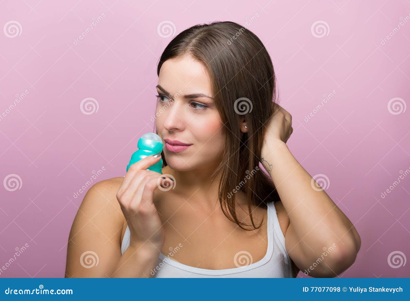 Woman with a deodorant stock photo. Image of odor, indoor - 77077098