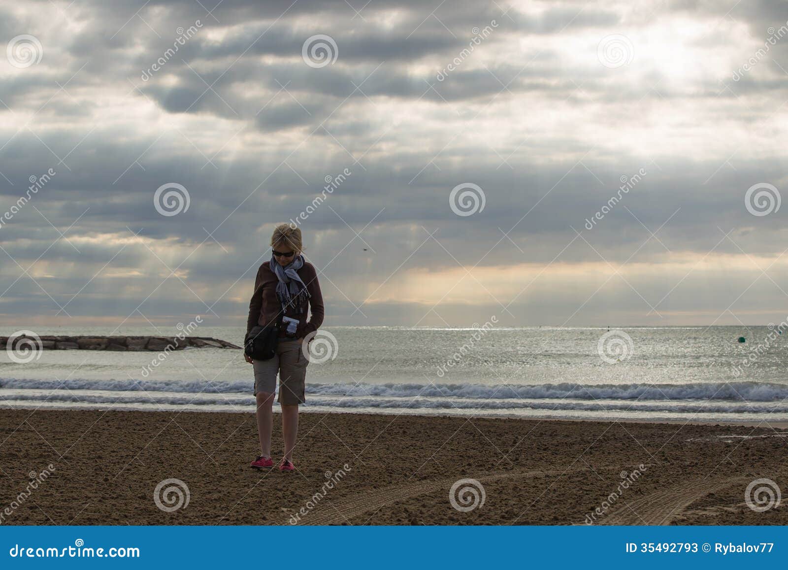 Woman on a deserted beach stock image. Image of nature - 35492793