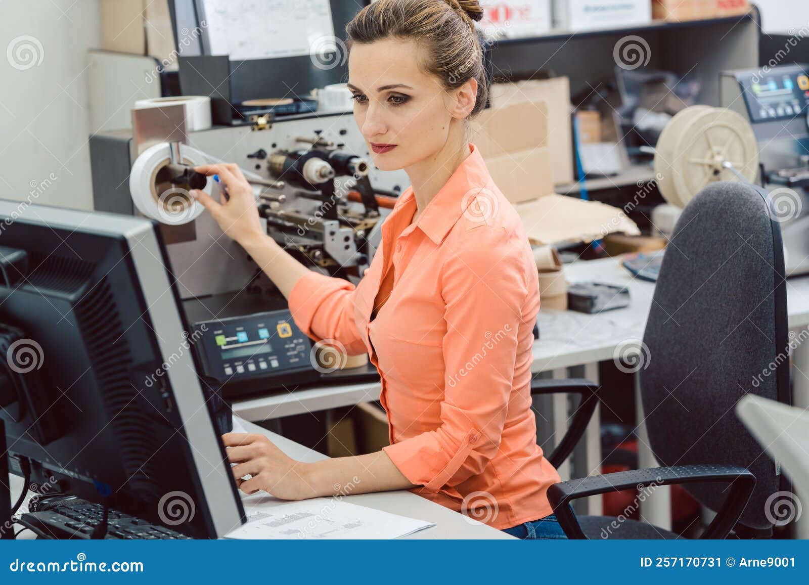 Woman Designing Labels To Be Printed on Label Printer in Workshop Stock ...