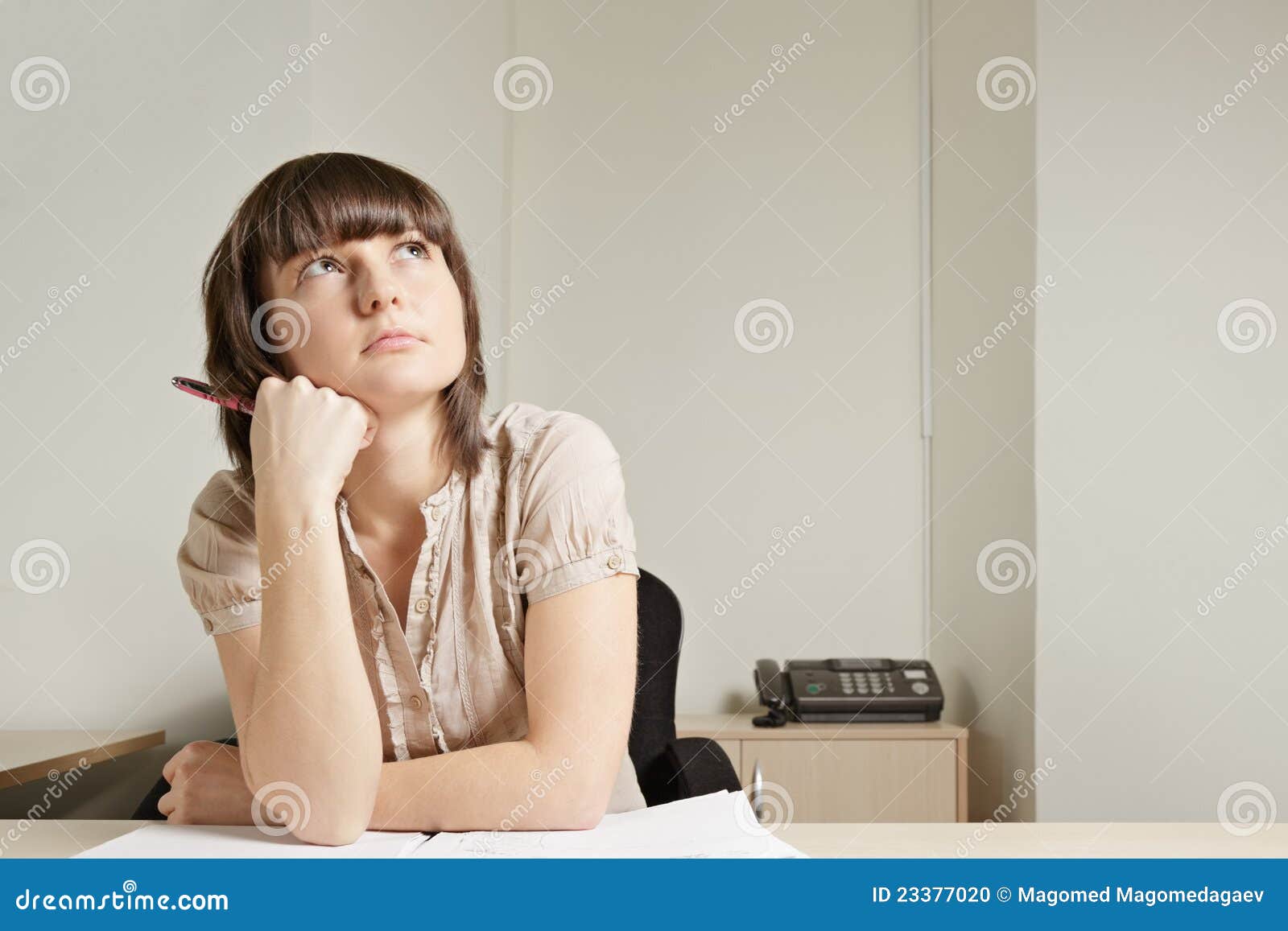 Woman at desk looking up stock photo. Image of pretty - 23377020