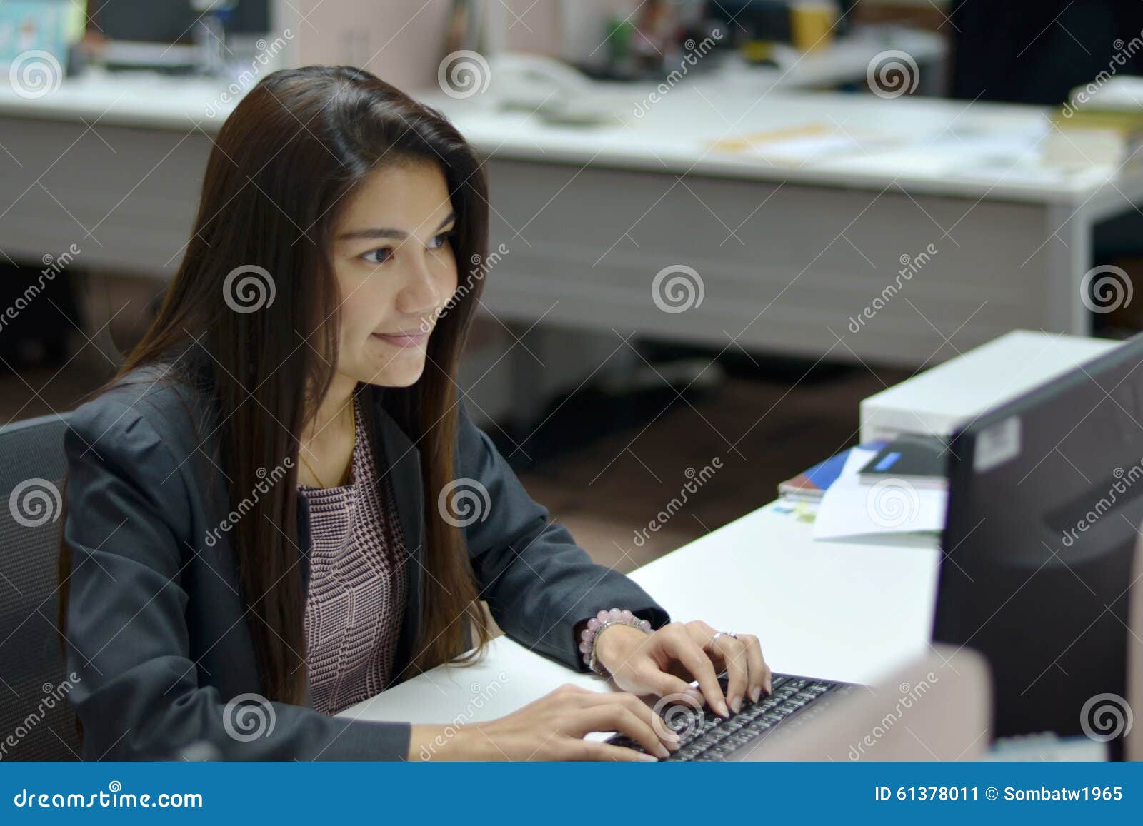 Woman at Desk Using Computer Stock Image - Image of woman, building ...