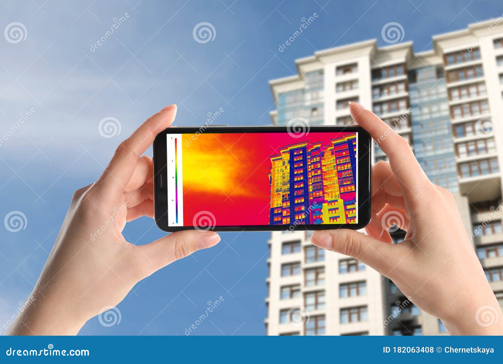 Woman Detecting Heat Loss in Building Using Thermal Viewer on ... Woman Detecting Heat Loss in Building Using Thermal Viewer on ...