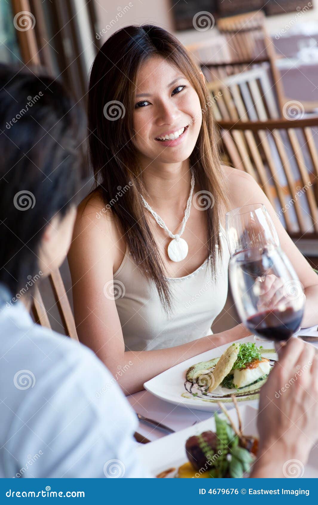 Woman at Dinner stock photo. Image of enjoying, asian - 4679676