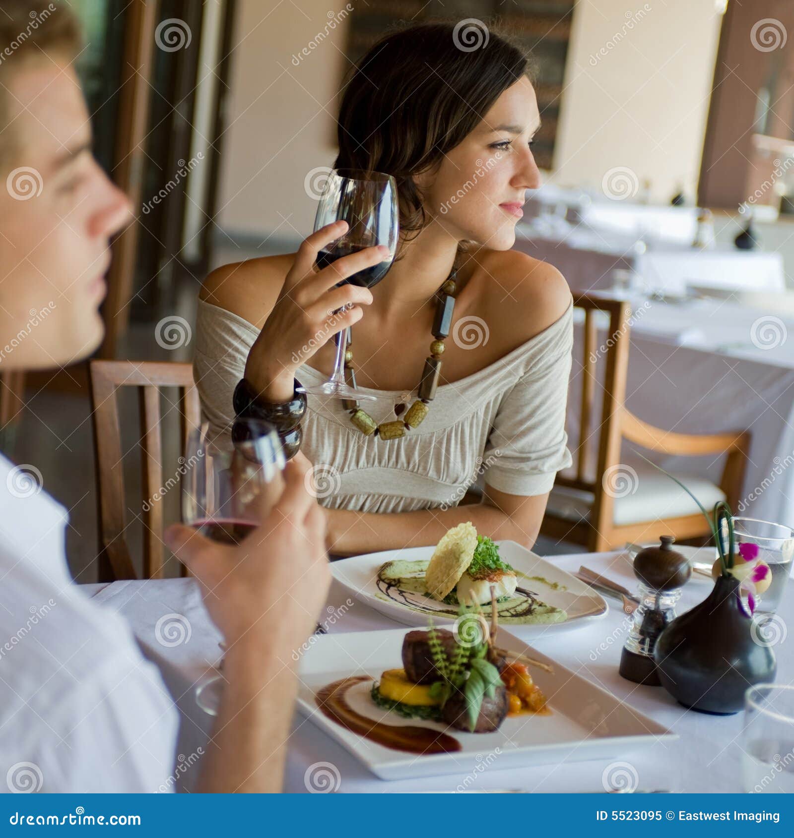 Woman at Dinner stock image. Image of resort, couple, expensive - 5523095