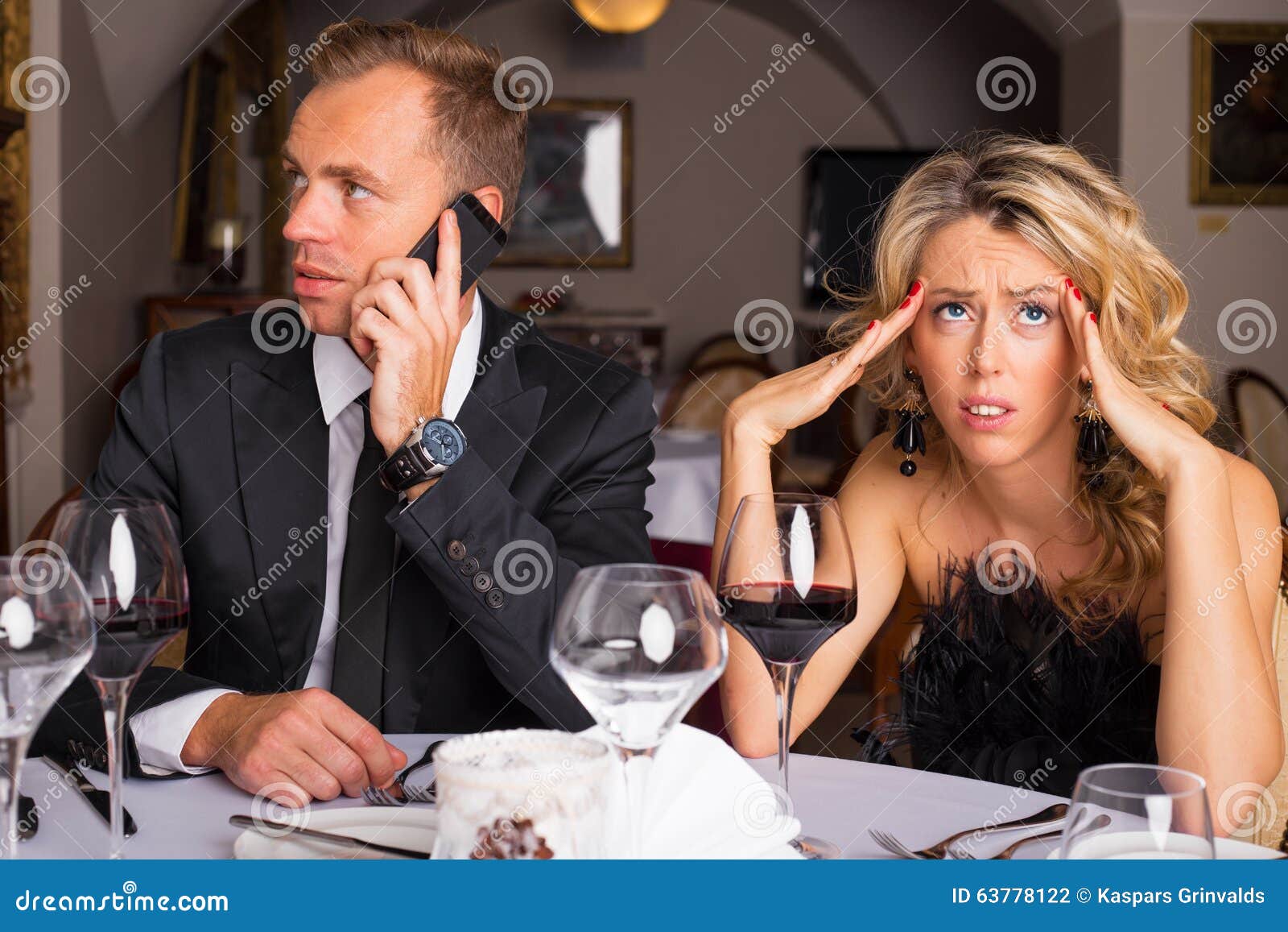Woman at Dinner Date Being Annoyed of Man Talking on the Phone Stock ...