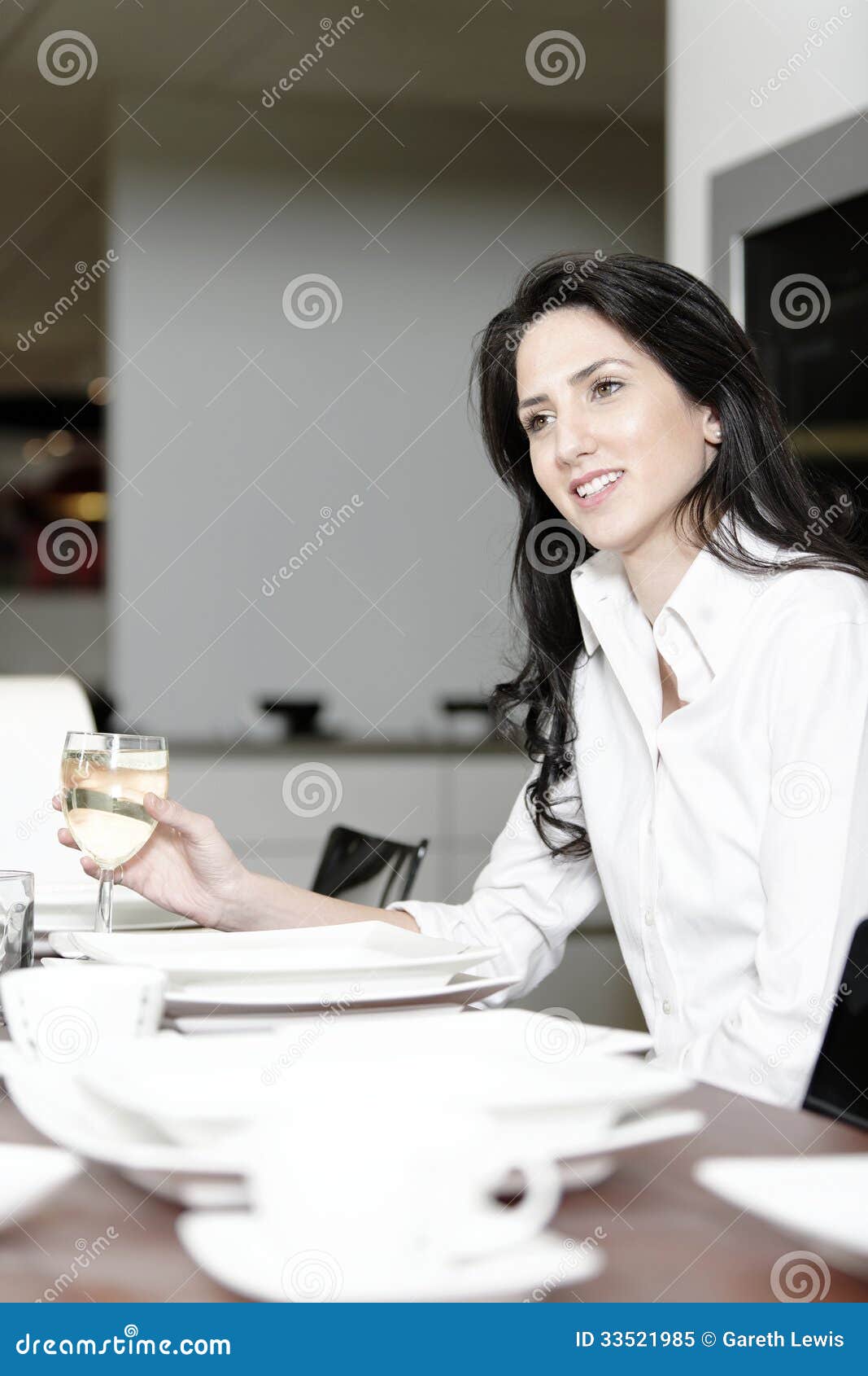 Woman at the dinner table stock image. Image of restaurant - 33521985
